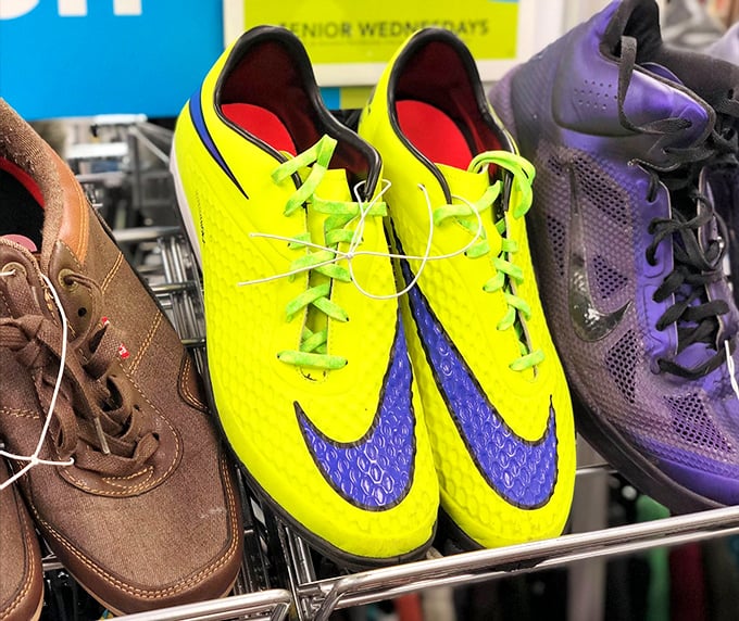 Neon soccer cleats flanked by sensible brown shoes—the footwear section is like a high school reunion where everyone's still trying to stand out.