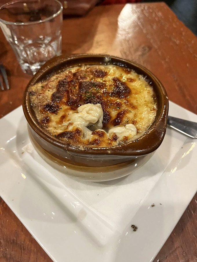 French onion soup that's worth the stringy cheese struggle. That caramelized crust is like the crispy edge of a relationship&mdash;often the best part.