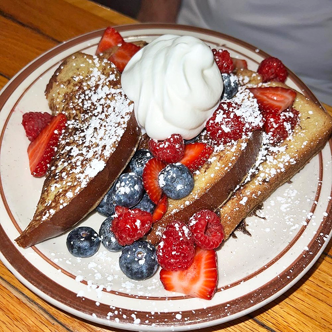 French toast that's dressed for success with berries, powdered sugar, and whipped cream playing the supporting roles they were born for.