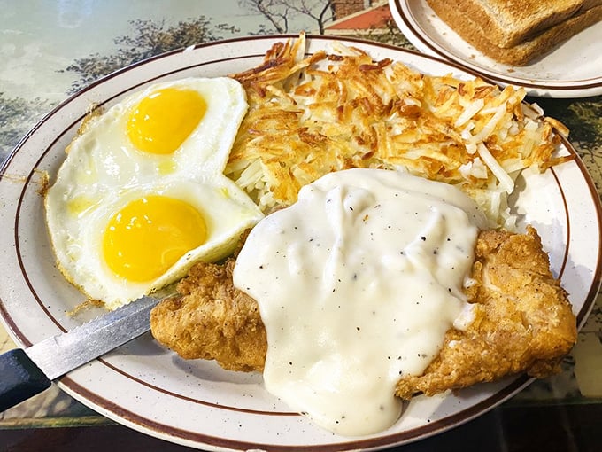 Fried chicken with eggs and potatoes&mdash;the holy trinity of comfort food that makes you want to hug the cook and take a nap simultaneously.