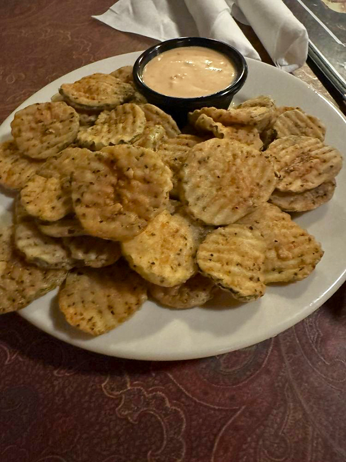 These aren't just fried pickles&mdash;they're crunchy discs of tangy perfection that disappear faster than your New Year's resolutions.
