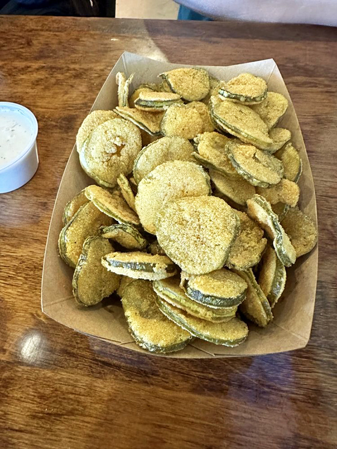 Fried pickles: the unsung heroes of Southern appetizers. Crispy, tangy discs that disappear faster than your resolution to "just have one."