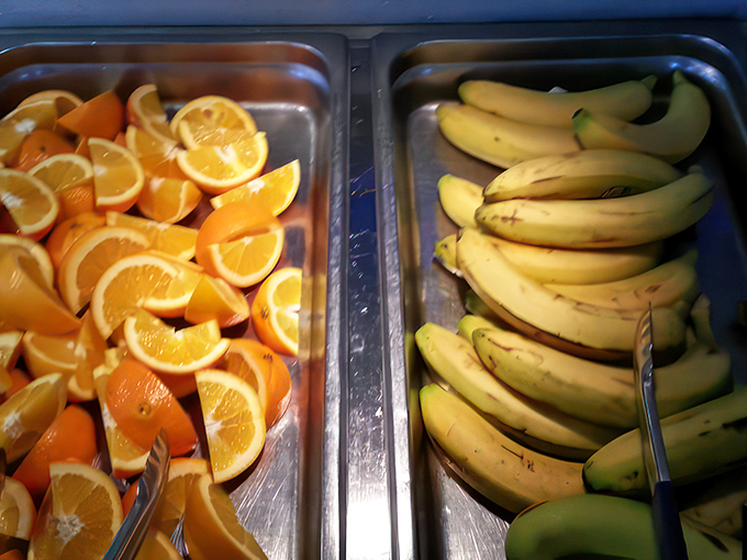 Oranges and bananas offering a vitamin intermission between acts of indulgence. Nature's palate cleanser awaits.
