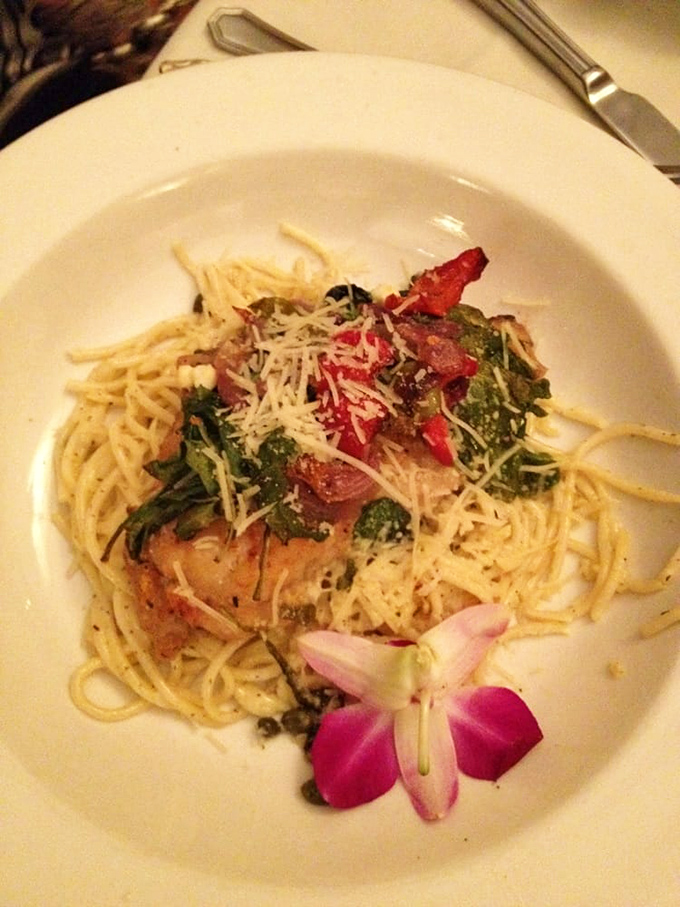 Pasta twirled beneath perfectly cooked fish, with that edible flower saying, "Yes, we're fancy, but in an unpretentious way." Fork-twirling perfection.