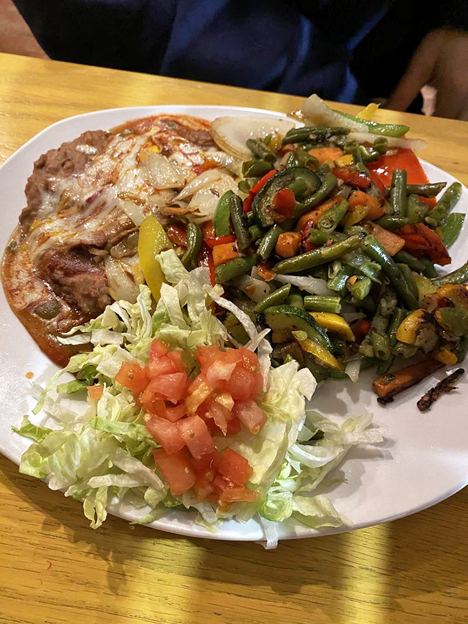 A plate that says "I contain multitudes"&mdash;vegetables that haven't been cooked into submission, beans with dignity, and what appears to be a perfectly grilled protein.