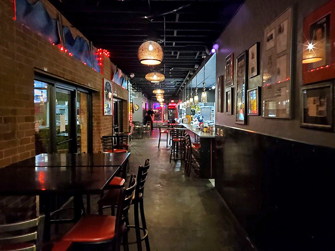 The hallway at Lindy's feels like a burger gallery, with exposed brick and warm lighting guiding you toward your impending food coma.