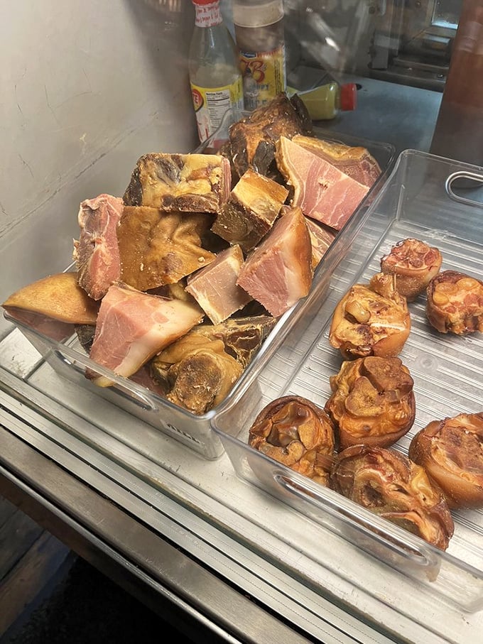 Raw ingredients awaiting transformation into country magic. This display case is basically a pork lover's jewelry store.