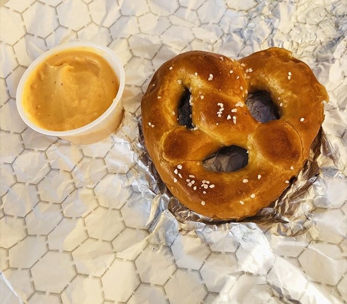 This isn't just a pretzel; it's a masterpiece of dough engineering. Warm, chewy perfection with mustard that means business.