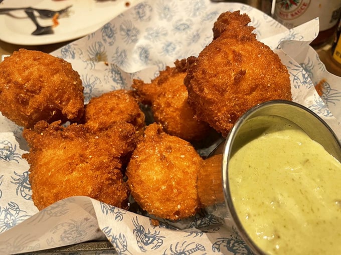 Hush puppies golden enough to make the sun jealous, served with a sauce that'll have you plotting your next visit before you've finished the first bite.