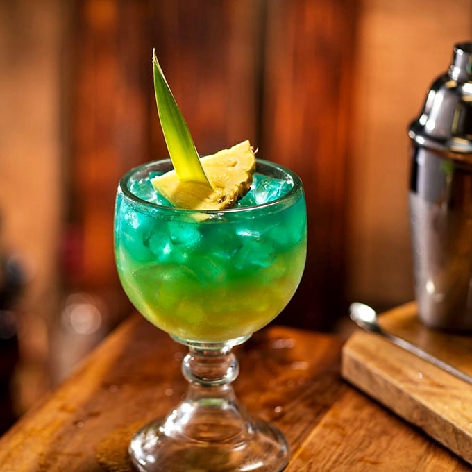 The Island Tiki cocktail brings tropical vacation vibes to Maryland. That blue-to-yellow gradient isn't just pretty&mdash;it's deliciously strategic.