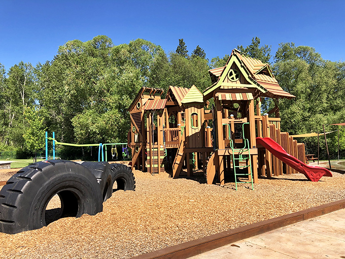 This playground proves even small-town kids get epic equipment&mdash;those tire tunnels and wooden castles putting city park plastic to shame.