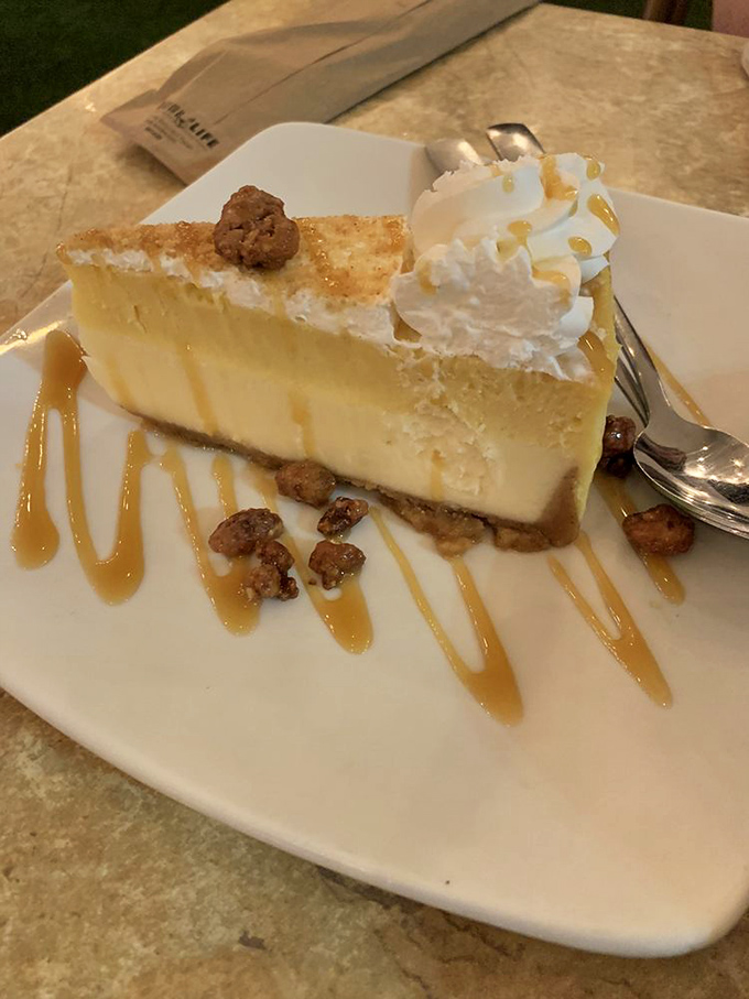 Key lime cheesecake with candied nuts—where Florida vacation memories meet New York sophistication on a plate. The drizzle of caramel is pure showmanship.
