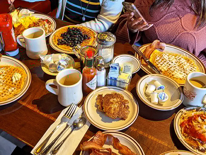 When your table looks like this, you know you've ordered correctly. Coffee mugs standing guard over a breakfast battlefield.