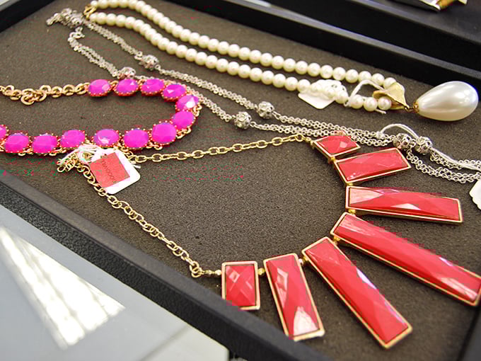 Jewelry that transforms ordinary outfits into statements. That pink necklace could turn a plain white tee into your new signature look.