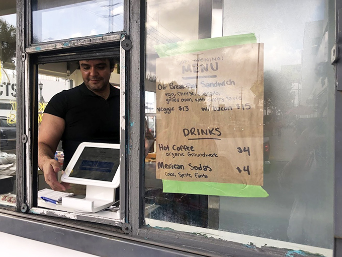 Where the magic happens. That handwritten menu is like a love letter to breakfast simplicity.