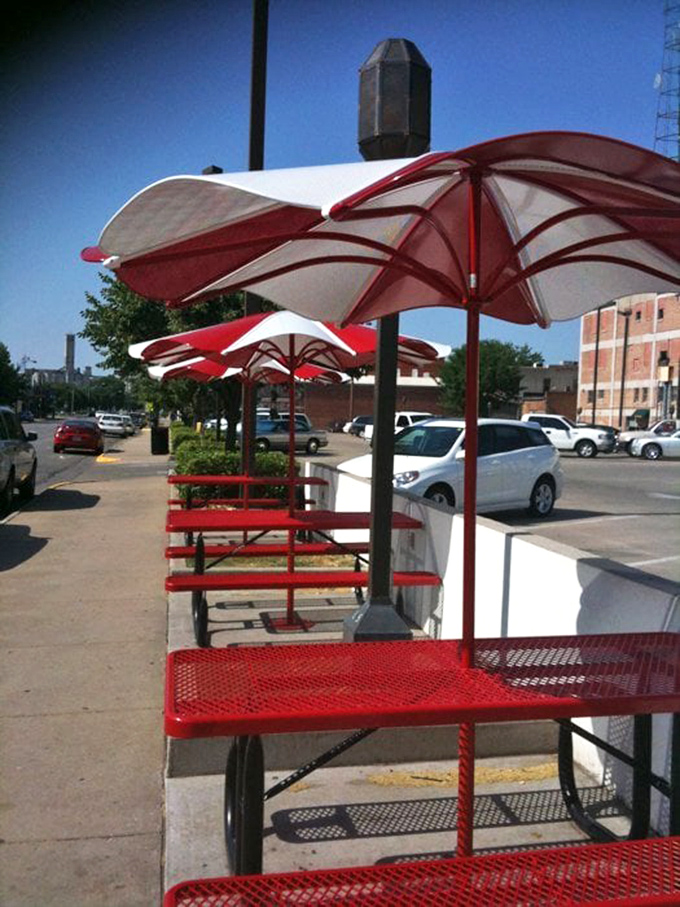 Al fresco dining, Cozy Inn style. These red umbrella tables have witnessed countless first bites and "Oh my God" moments.