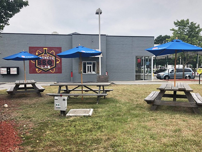 Al fresco dining, Carolina-style &ndash; picnic tables under blue umbrellas where the only ambiance needed is the aroma from inside.