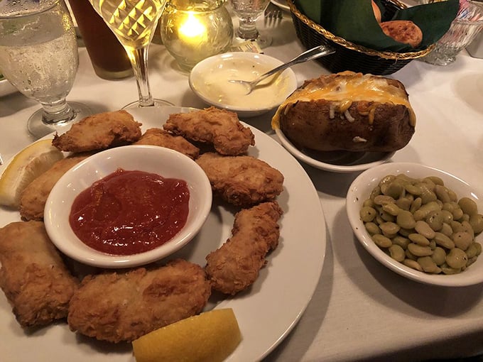 Fried oysters arranged like a delicious clock counting down to flavor o'clock. Those lima beans aren't just sides &ndash; they're supporting actors in a culinary drama.