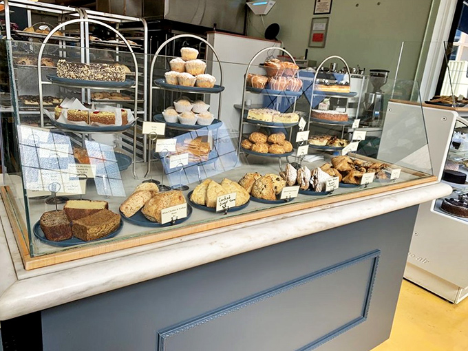 This isn't just a bakery display&mdash;it's carbohydrate heaven. Breads and pastries arranged with the care of a curator organizing a delicious exhibition.