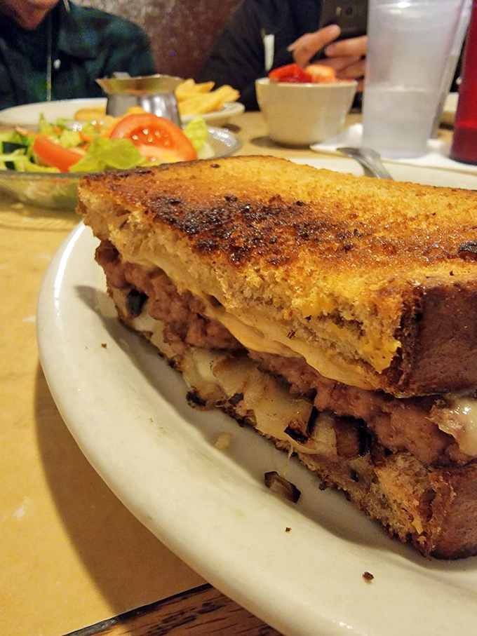 A grilled sandwich that whispers sweet nothings to your taste buds. The side salad pretends you're making healthy choices.