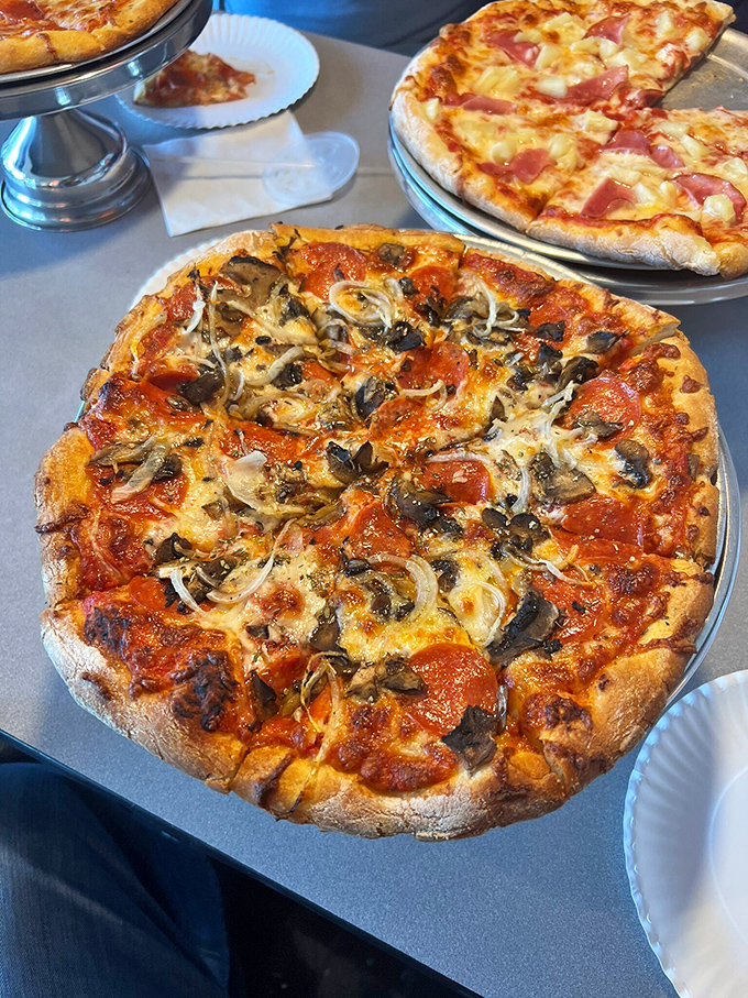 Pepperoni and mushroom—the Fred Astaire and Ginger Rogers of pizza toppings, dancing together in perfect harmony on a stage of melted cheese.