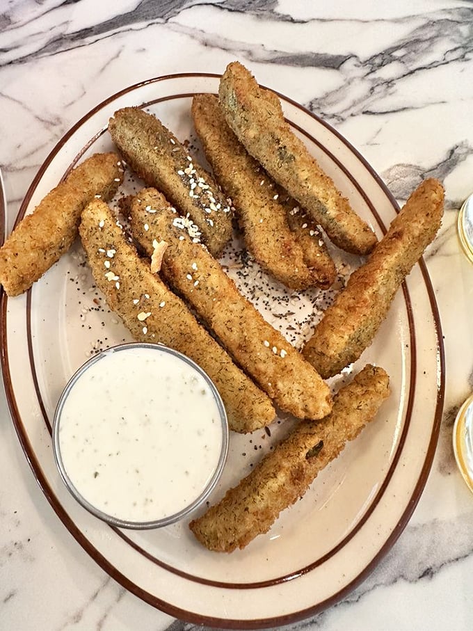 Pickle fries: the love child of a dill pickle and a French fry, raised by a mad culinary genius. They're crispy, tangy, and more addictive than your favorite binge-worthy TV show.