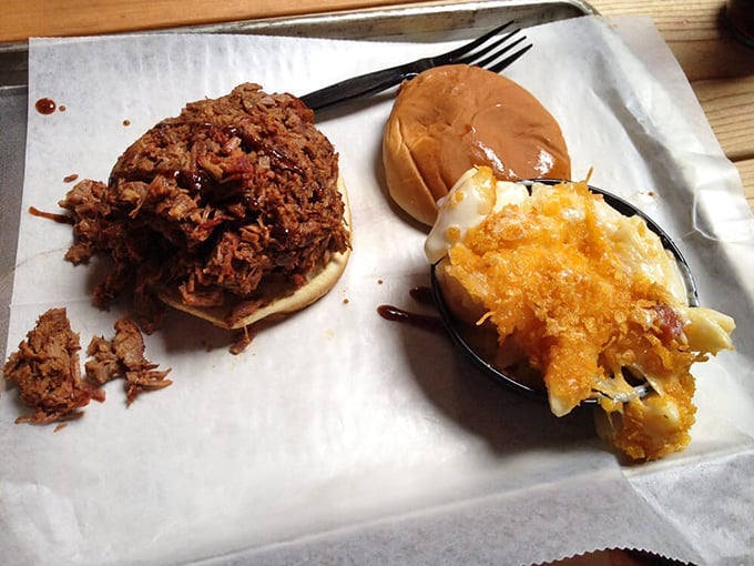 This pulled pork sandwich isn't just lunch &ndash; it's an edible hug on a bun, with meat that surrendered to smoke for your pleasure.