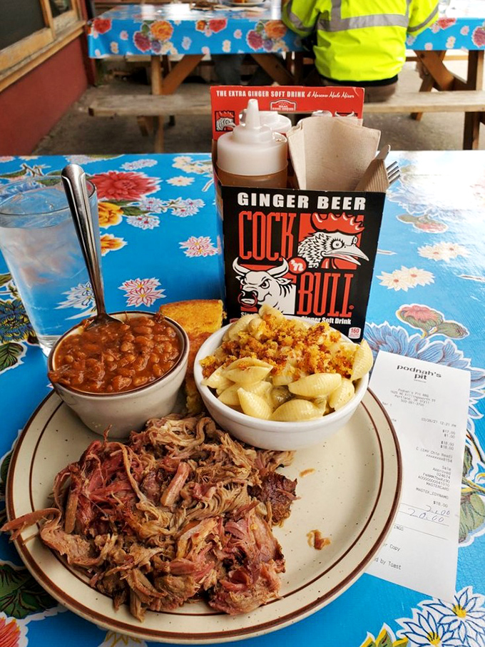 Collard greens that have been coaxed into tenderness, brisket with that telltale pink smoke ring, and slaw that cuts through the richness perfectly. 