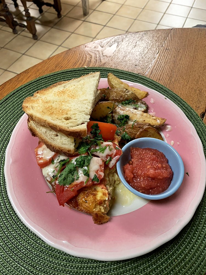 Breakfast platter perfection: eggs, potatoes, toast and a side of homemade salsa. This isn't just a meal, it's morning motivation on a pink plate.