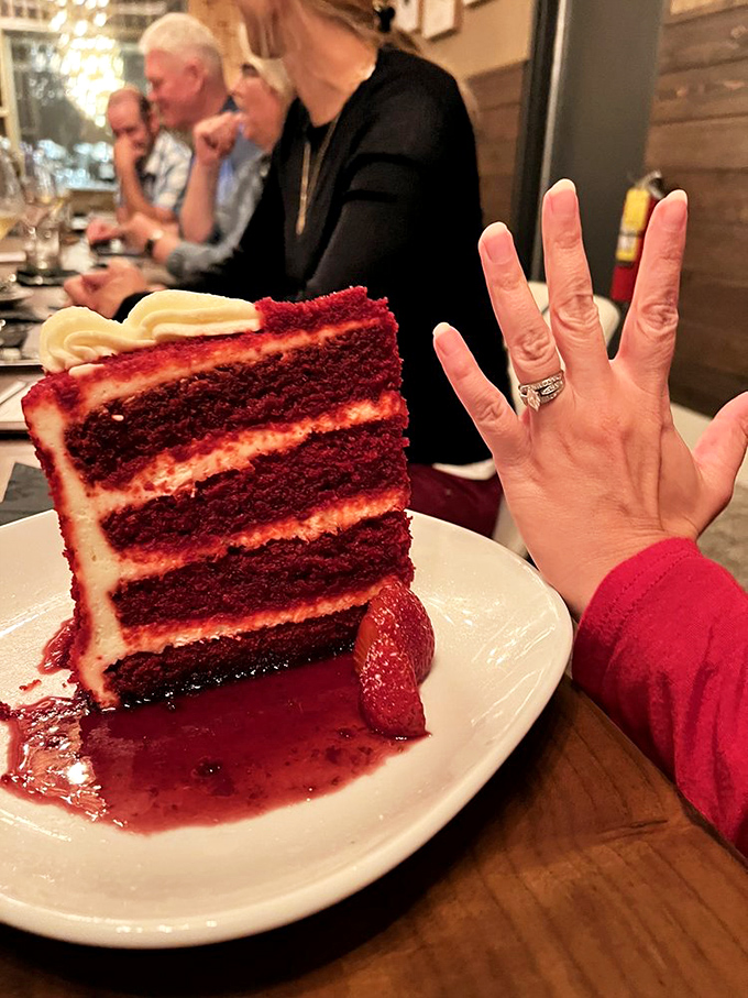 Red velvet cake so impressive it deserves its own engagement ring. Those layers are architectural marvels of buttercream engineering.