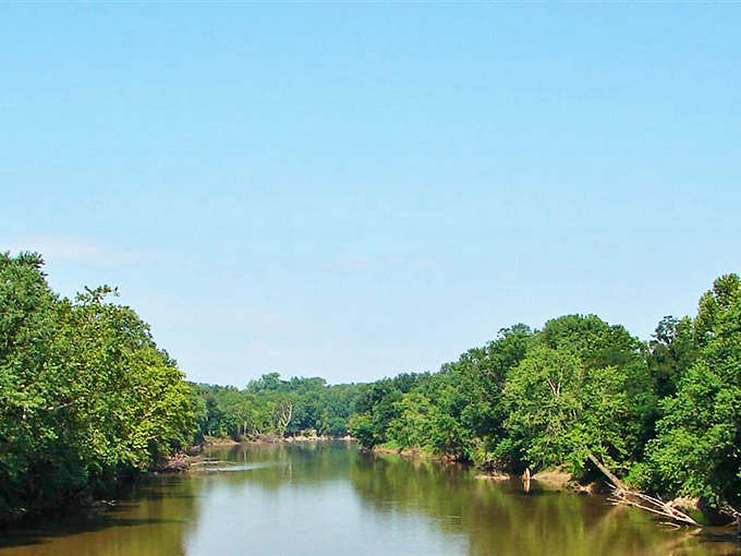 The White River meanders through lush greenery, creating a peaceful corridor where time flows as languidly as the water itself.