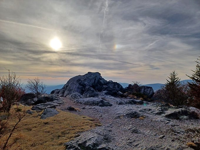 Ancient rocks stand sentinel against a moody sky. They've been practicing social distancing for millions of years.