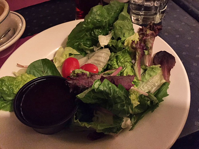 Even the salad looks purposeful here – a crisp, fresh prelude that doesn't apologize for being the opening act to the steak headliner.