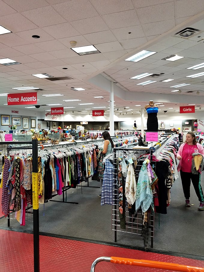 Serious shoppers navigate the clothing section with the focus of archaeologists, each rack potentially hiding that perfect fashion fossil.