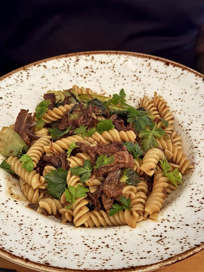 Pasta that doesn't just sit on the plate but tells a story—each spiral capturing sauce like it was born for this purpose.