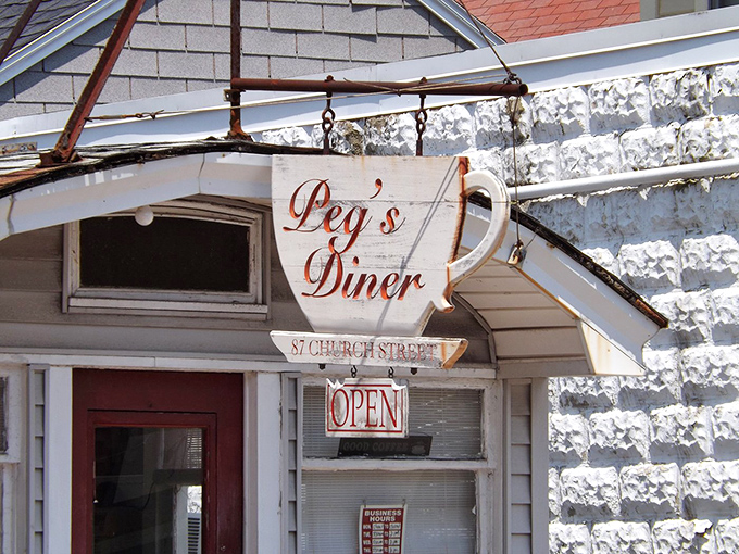That coffee cup sign isn't just advertising&mdash;it's a beacon of hope for those of us who measure mornings in caffeine and comfort.