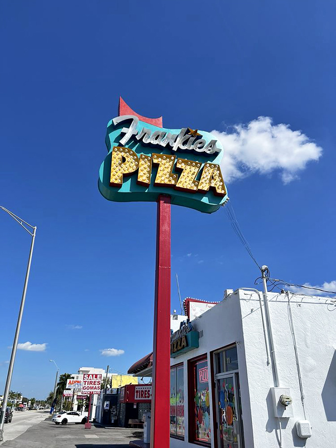 Against Miami's blue sky, this sign isn't just advertising&mdash;it's a promise. Like a mid-century modern lighthouse guiding you to pizza paradise.