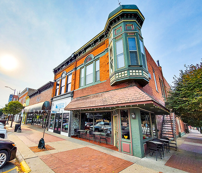 Smokey Row Coffee's corner location with that gorgeous turquoise bay window is where caffeine meets conversation in the most delightful architectural package.