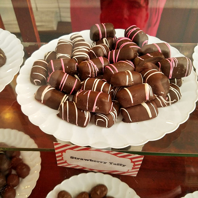 These aren't just strawberry taffies &ndash; they're pink-striped promises of joy, hand-pulled and cut with the kind of care that makes you slow down and savor each bite.