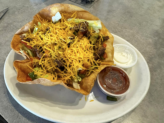 This taco bowl doesn't care about authenticity debates – it's too busy making your taste buds dance with cheese-topped joy.