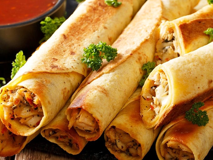 Crispy taquitos lined up like delicious cigars (that won't kill you), their golden exteriors giving way to savory fillings that make sharing feel like a personal sacrifice.