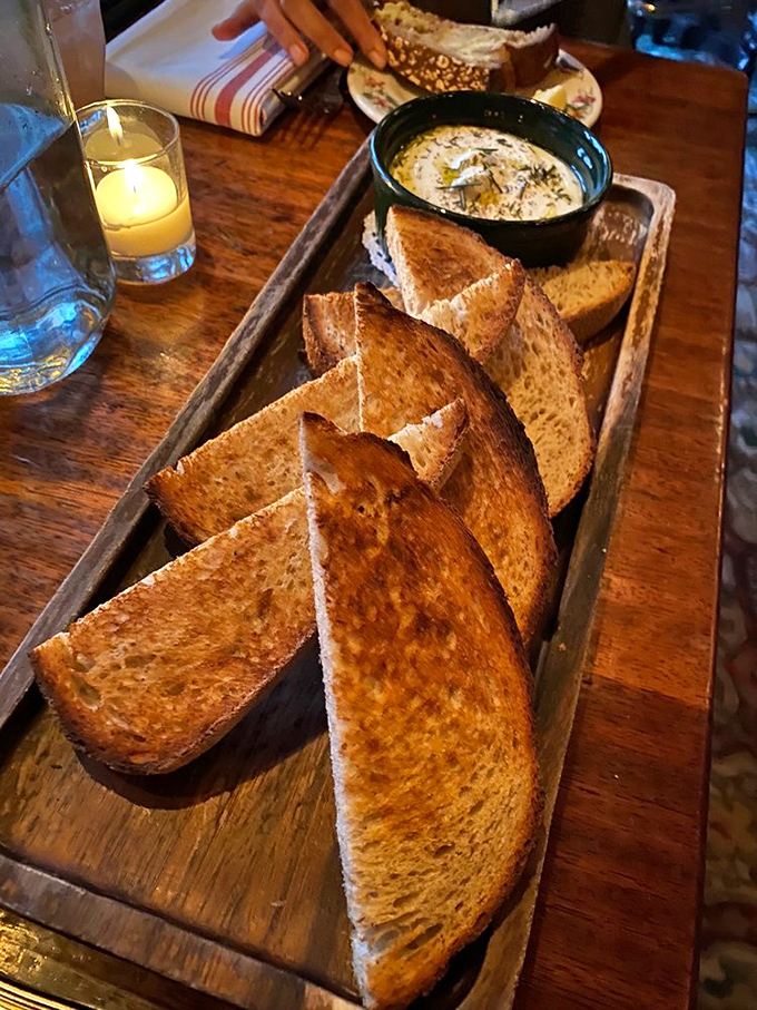 Toast elevated to an art form&mdash;golden-brown soldiers lined up beside what appears to be a pot of melted heaven, ready for the dipping ritual that transcends all cultural boundaries.