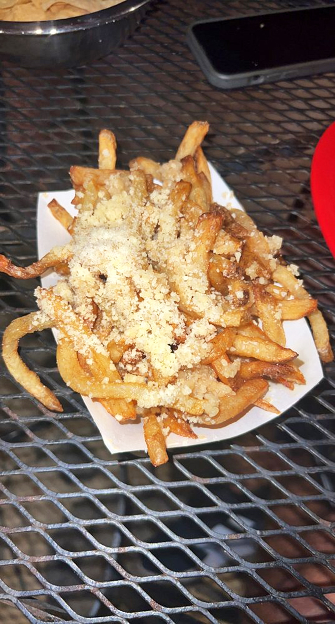 These aren't just fries &ndash; they're golden treasures dusted with parmesan fairy dust that transforms potatoes into addiction.