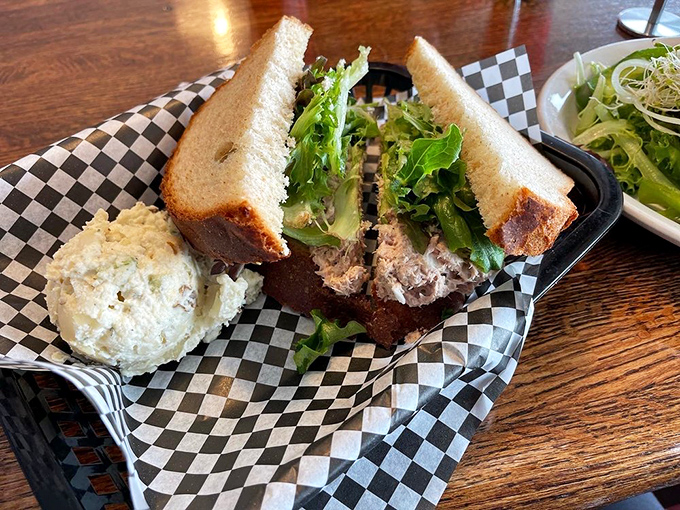 A tuna sandwich that respects tradition while adding fresh greens. Served on hearty bread with potato salad&mdash;lunch doesn't get more classically satisfying than this.