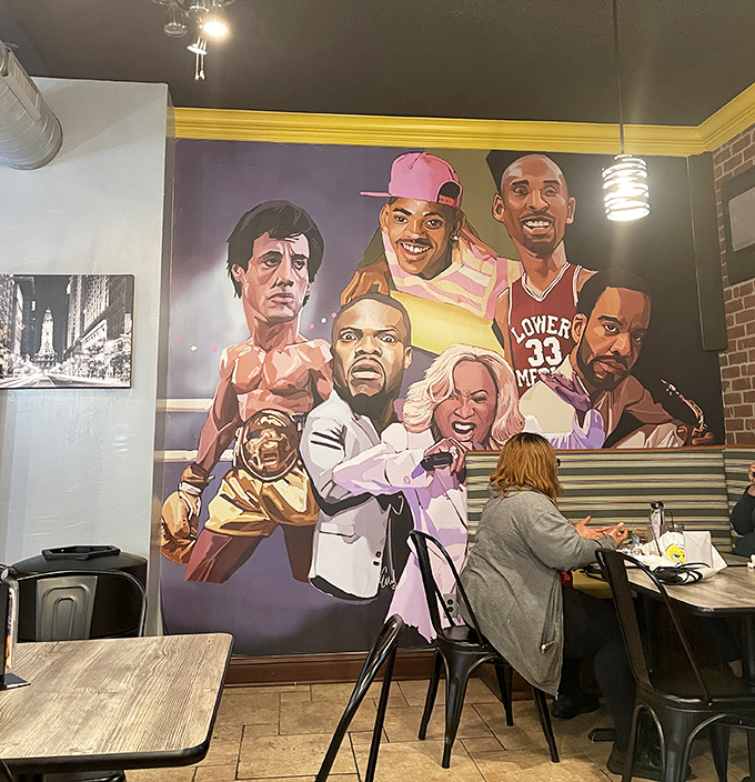 Philadelphia icons watch over diners from this vibrant mural. Rocky, Fresh Prince, and Philly sports legends stand guard as you tackle your cheesesteak.