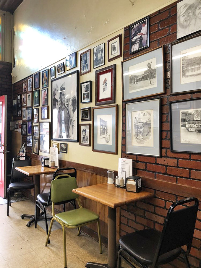 The wall of fame tells stories that TripAdvisor never could. Each frame holds a chapter of Mount Airy history.
