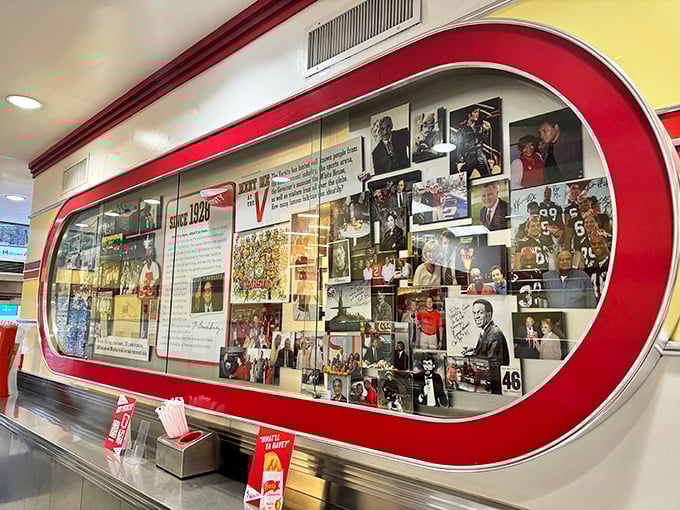 The wall of fame showcases decades of happy customers, celebrities, and memories&mdash;a visual testament to The Varsity's place in Atlanta's heart.