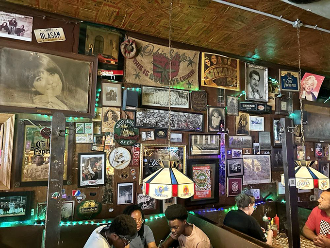 The walls aren't just decorated; they're curated with decades of memories, creating a living scrapbook of Columbus culture and Buckeye pride.