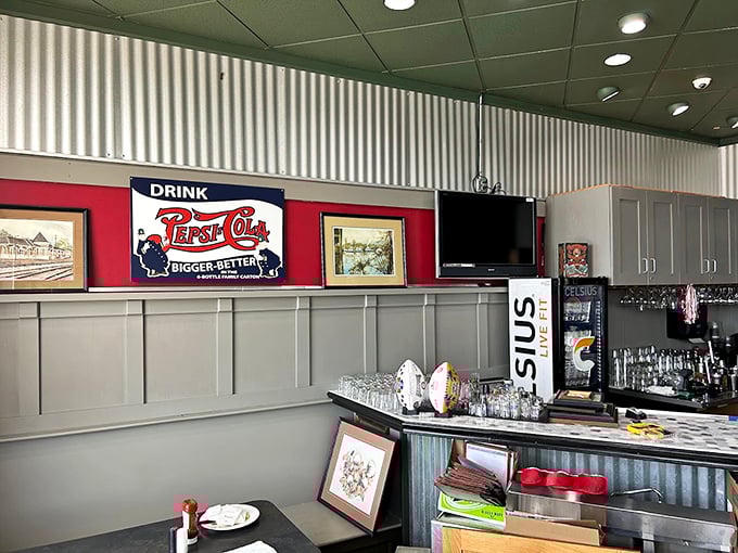 Vintage Pepsi-Cola signs and local artwork create that authentic Southern diner atmosphere that no corporate chain could ever replicate.