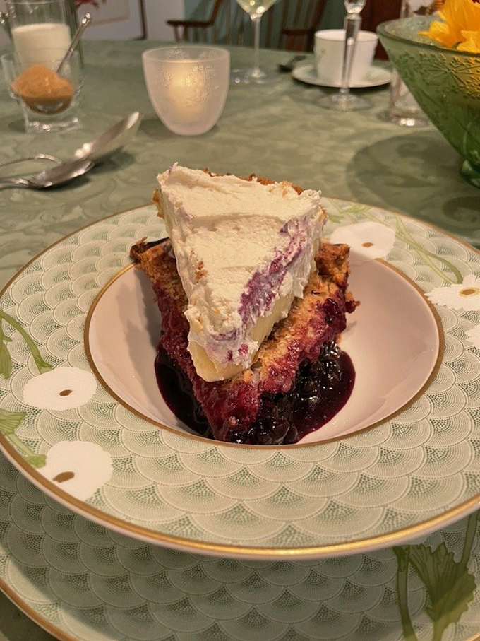 This slice of wild Maine blueberry pie has that perfect purple-stained filling that says "summer memories" in every juicy bite.